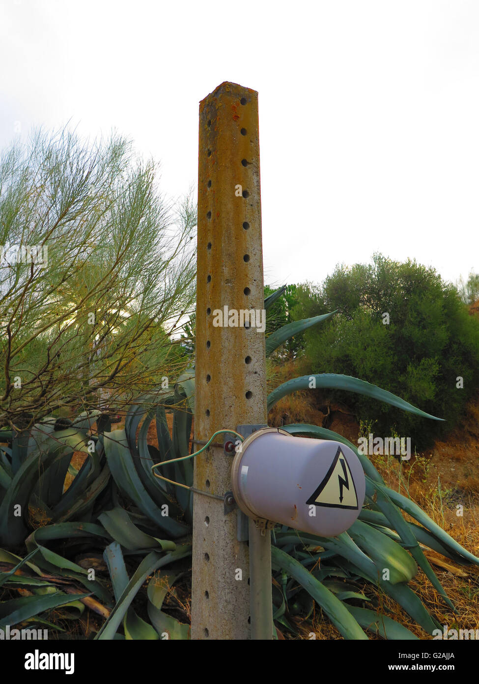Danger sign on Electric railway post near Alora, Andalucia Stock Photo ...
