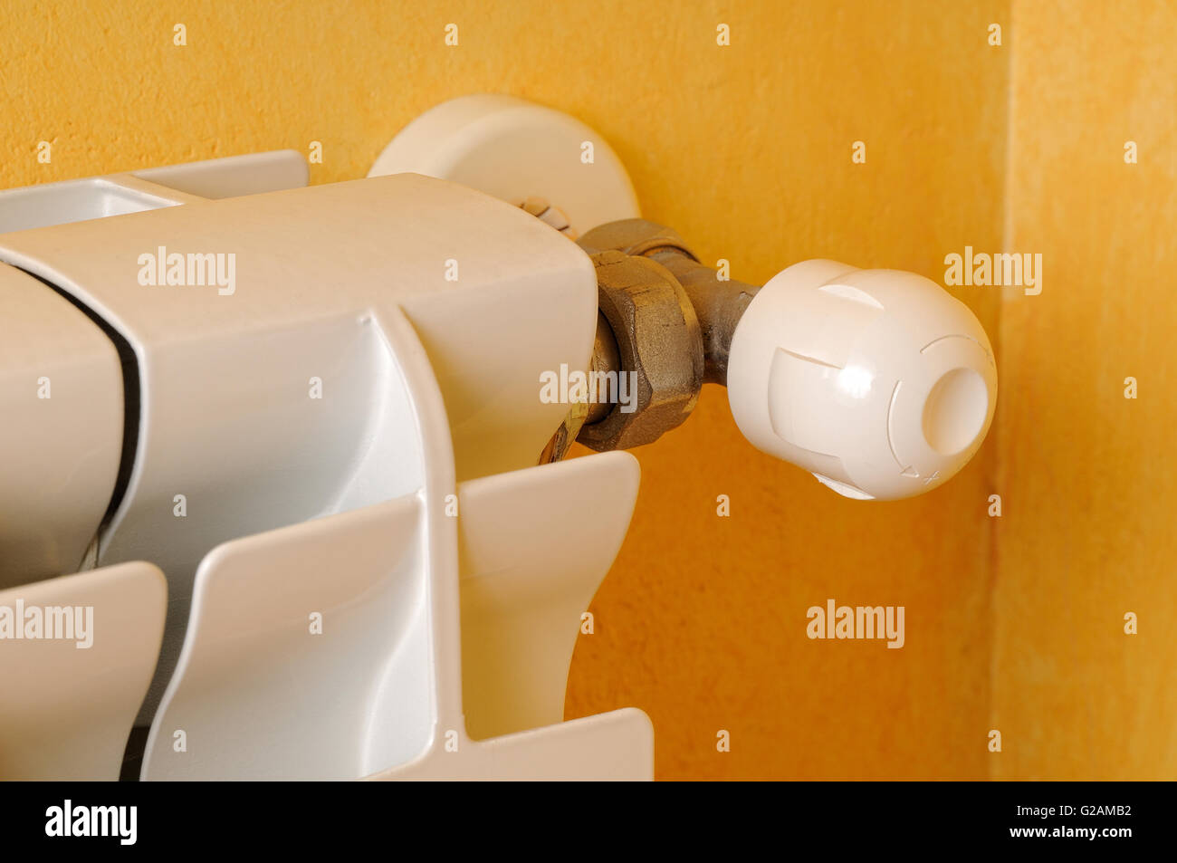 White aluminum heating radiator regulator detail Stock Photo - Alamy
