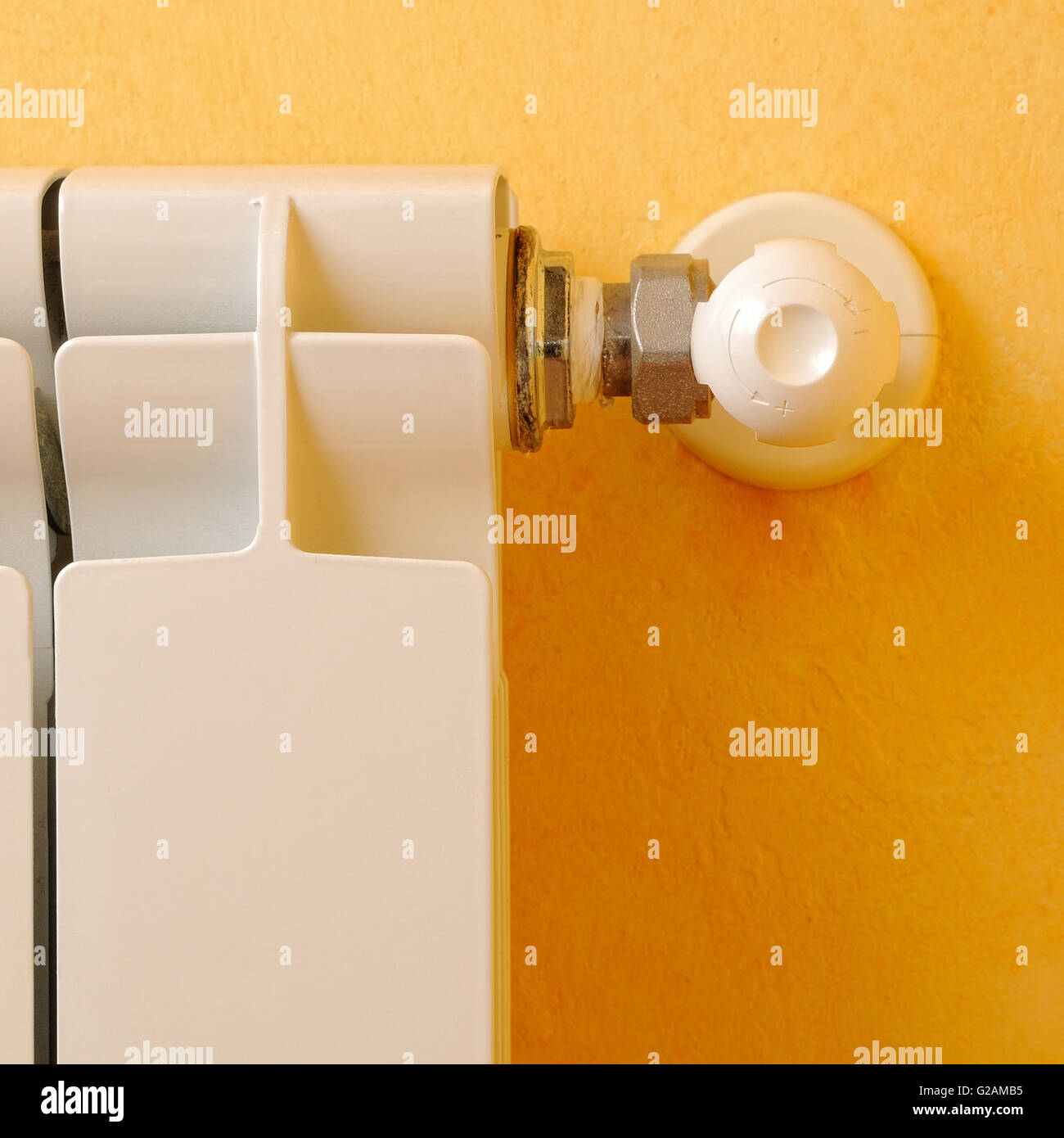 White aluminum heating radiator regulator front detail Stock Photo - Alamy