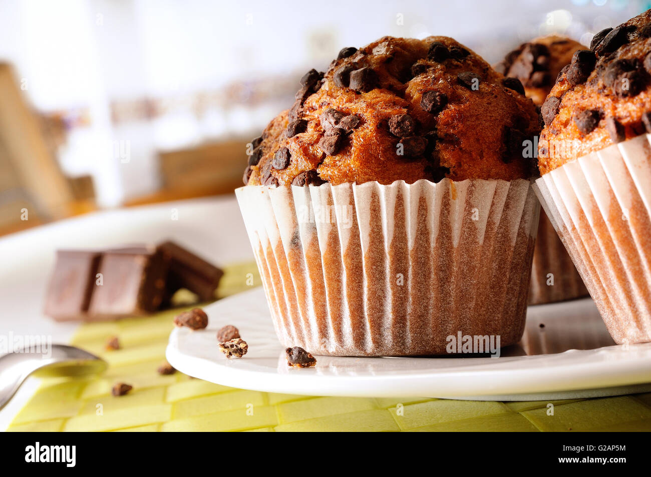 chocolate chip muffins on a table in the kitchen Stock Photo - Alamy