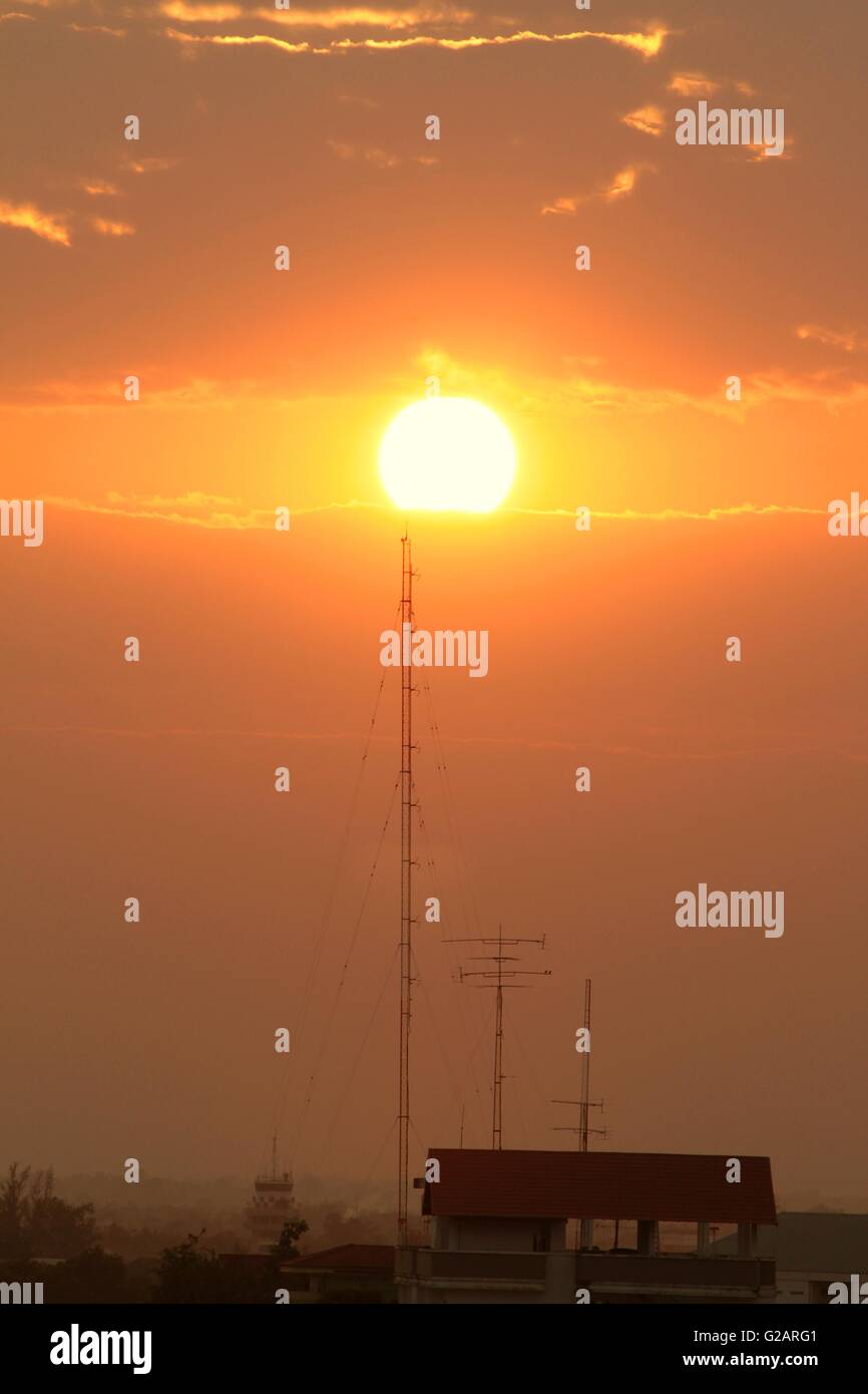 Telecommunication tower in golden sunset background Stock Photo - Alamy