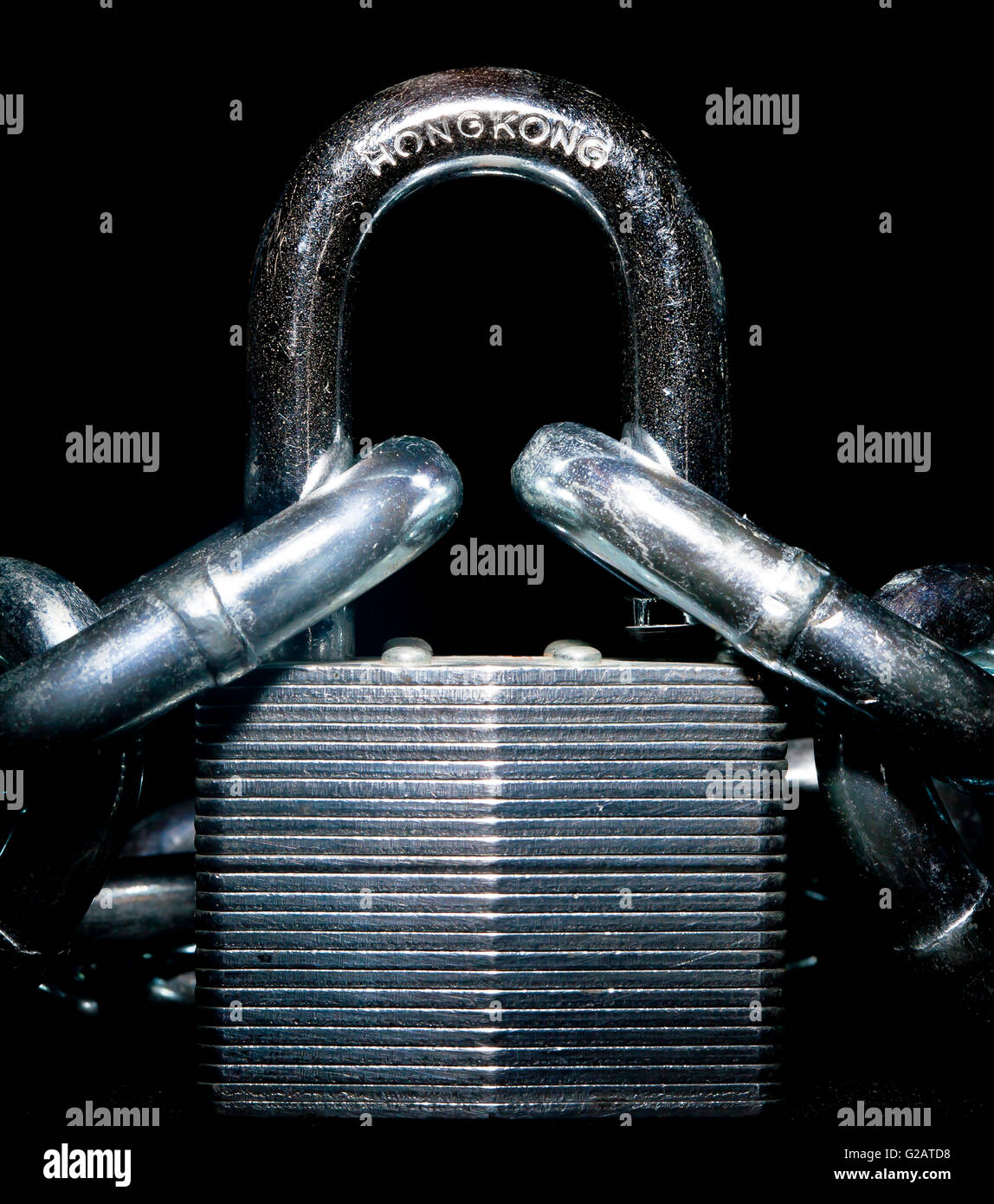 unlocked padlock holding two links of steel chain Stock Photo - Alamy