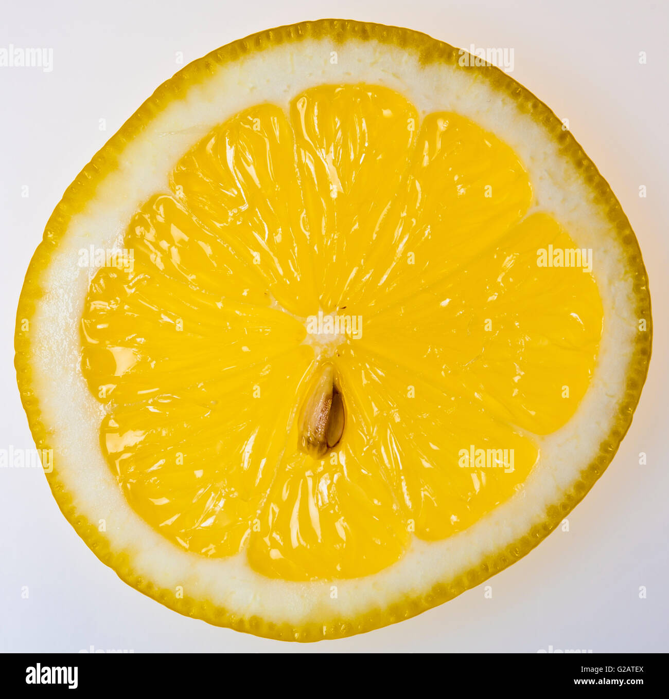 lemon slice with seed on white background Stock Photo - Alamy