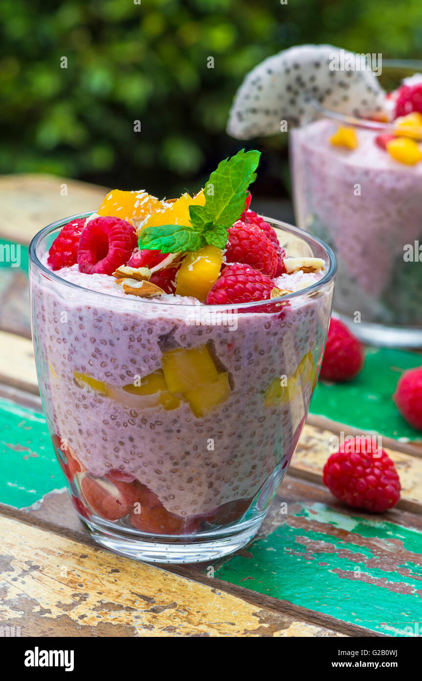 Raspberry Chia seed pudding layered and topped with fresh fruit Stock ...