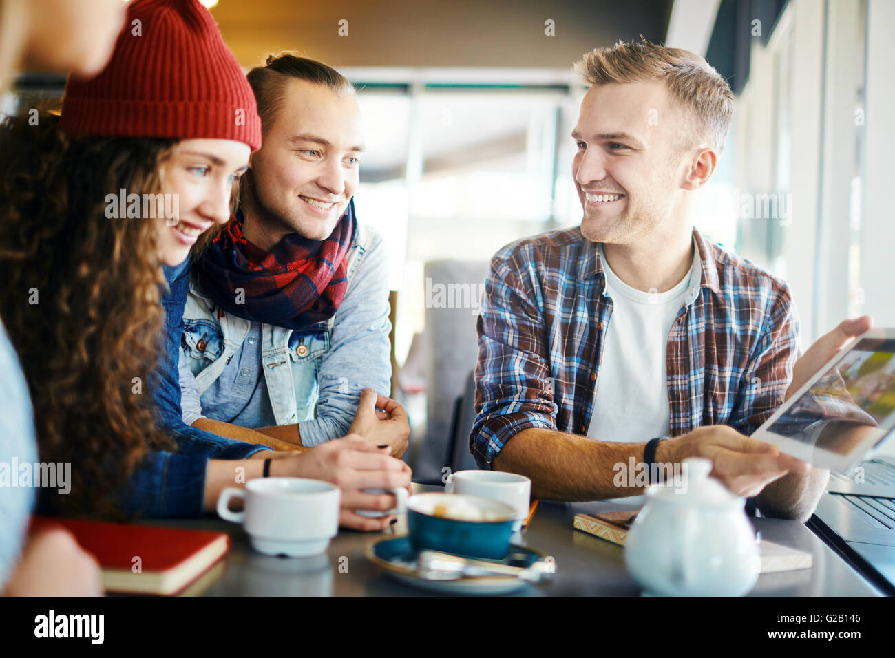 Using computer at café Stock Photo - Alamy