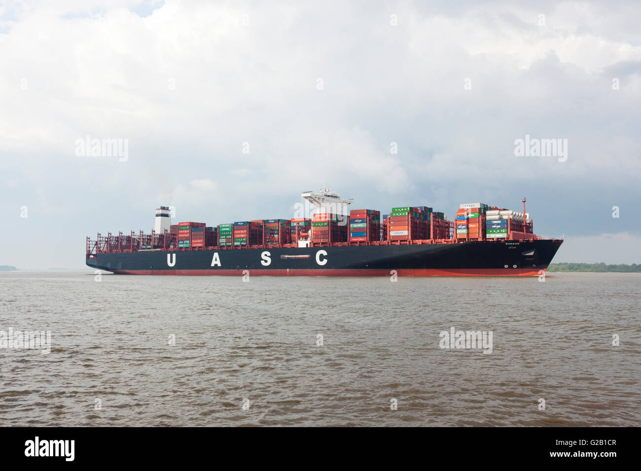 Ultra large container ship MV Barzan on the Elbe river near Hamburg ...