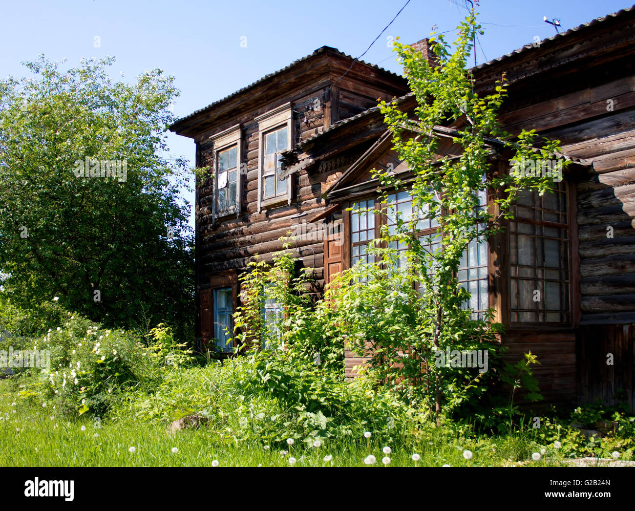 the old house is hiding behind trees Stock Photo - Alamy