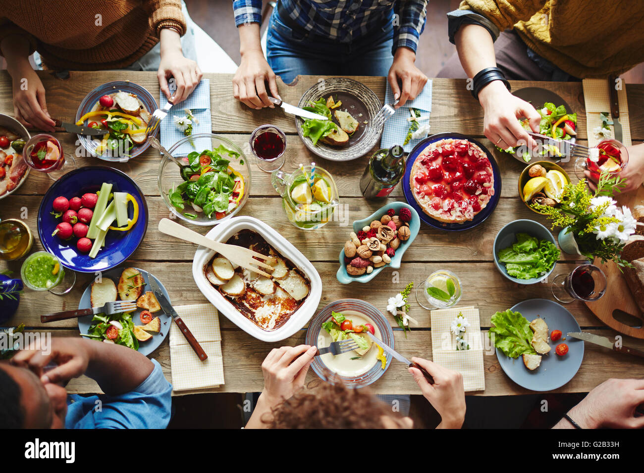 Sitting by dining table hi-res stock photography and images - Alamy