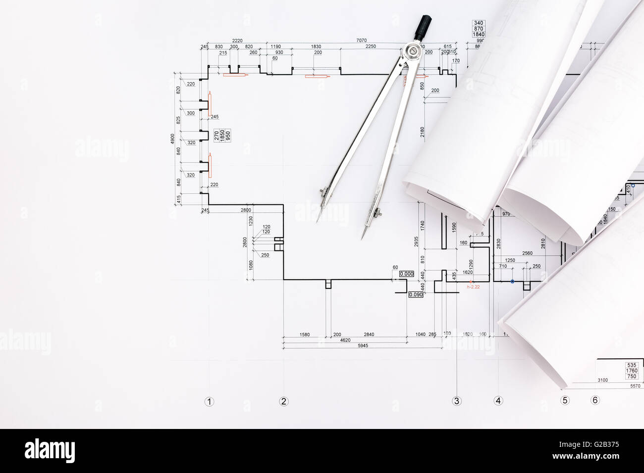 rolls of architectural blueprints and technical drawings with drawing ...