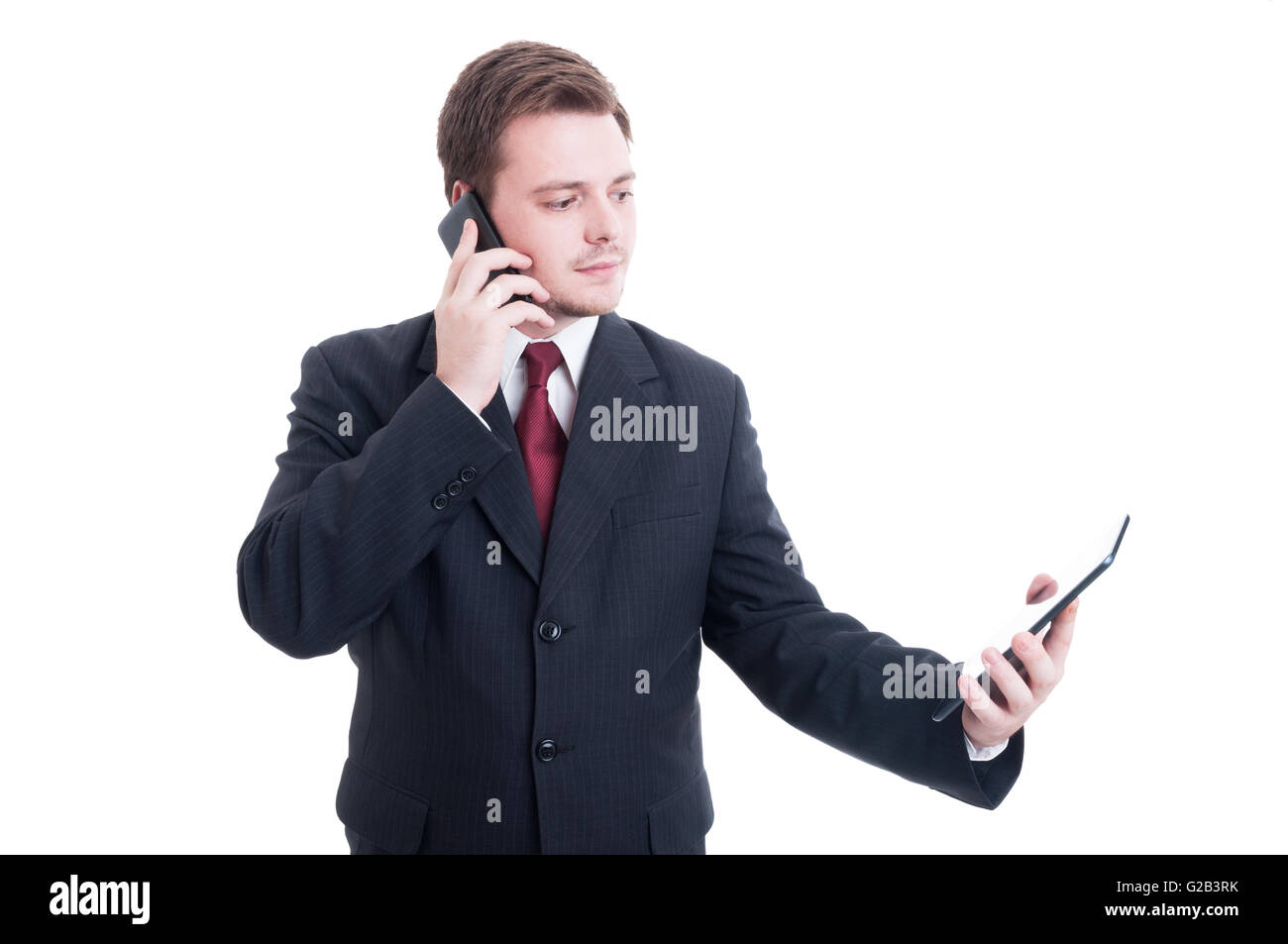 Busy business person using phone and tablet as multitasking concept ...