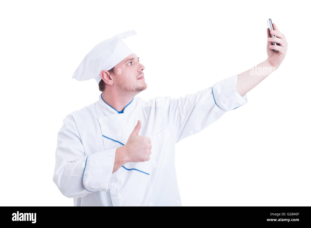 Chef or cook taking selfie with phone camera showing like thumbup ...
