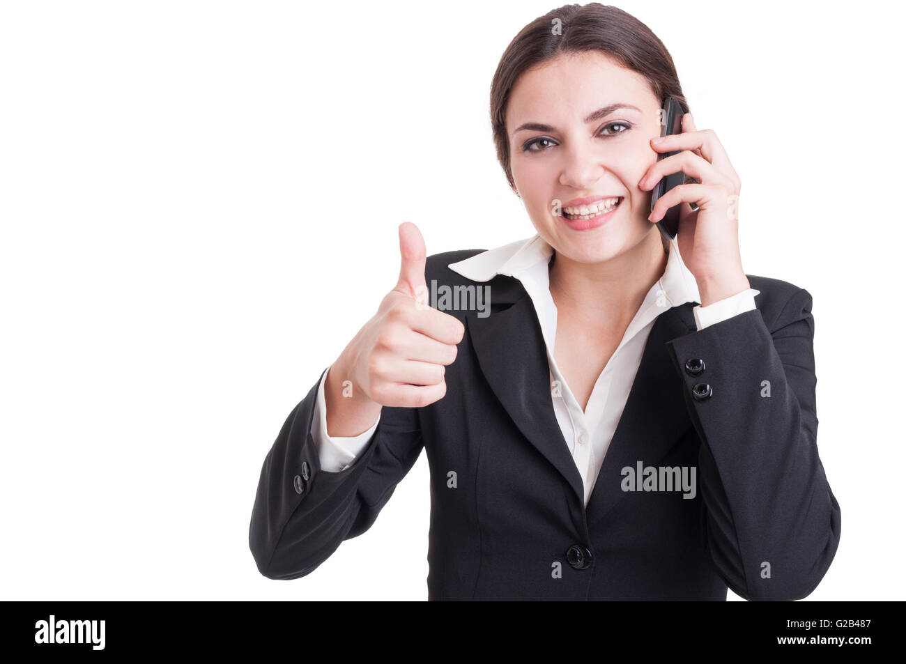 Smiling happy business woman showing like or thumb-up gesture while ...