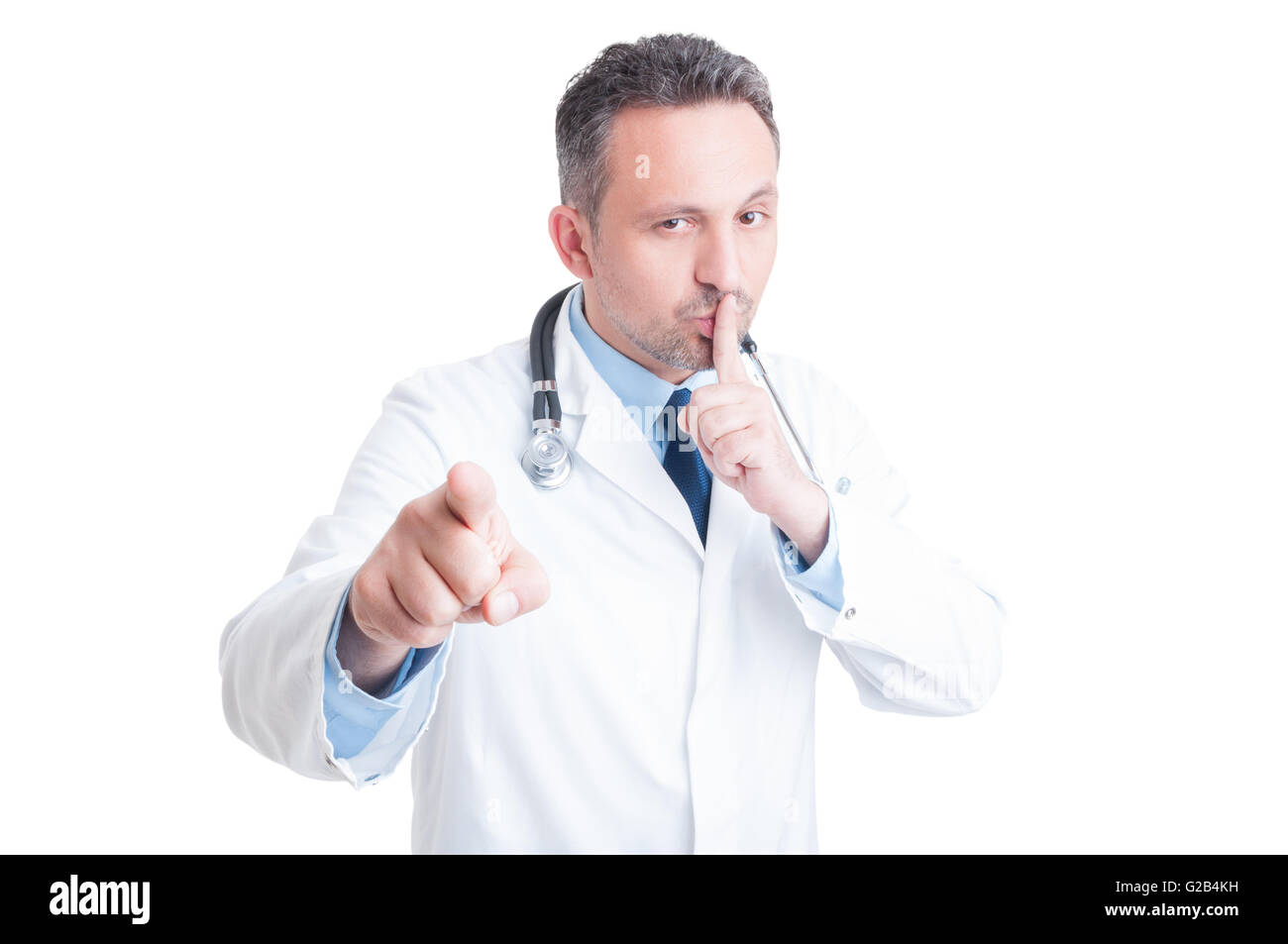 Doctor or medic making silence and quiet gesture with finger on lips as ...