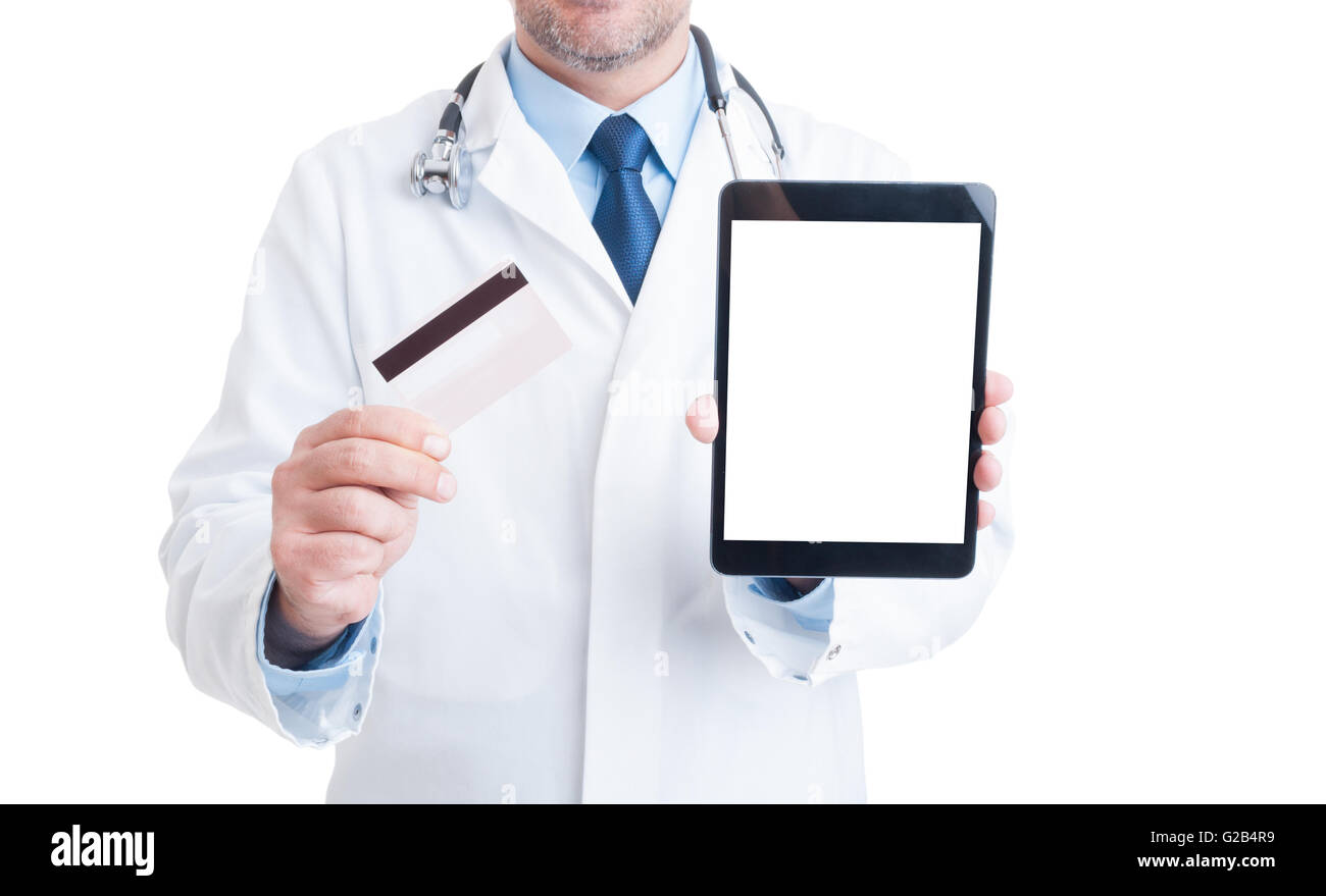 Doctor showing credit card and blank screen tablet with copy space and ...