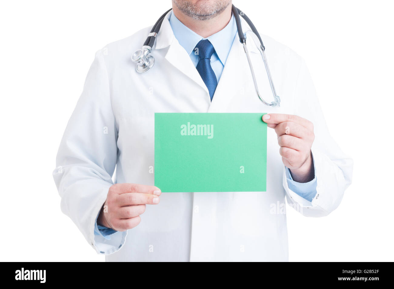 Anonymous doctor or medic holding green blank paper with copy space and ...