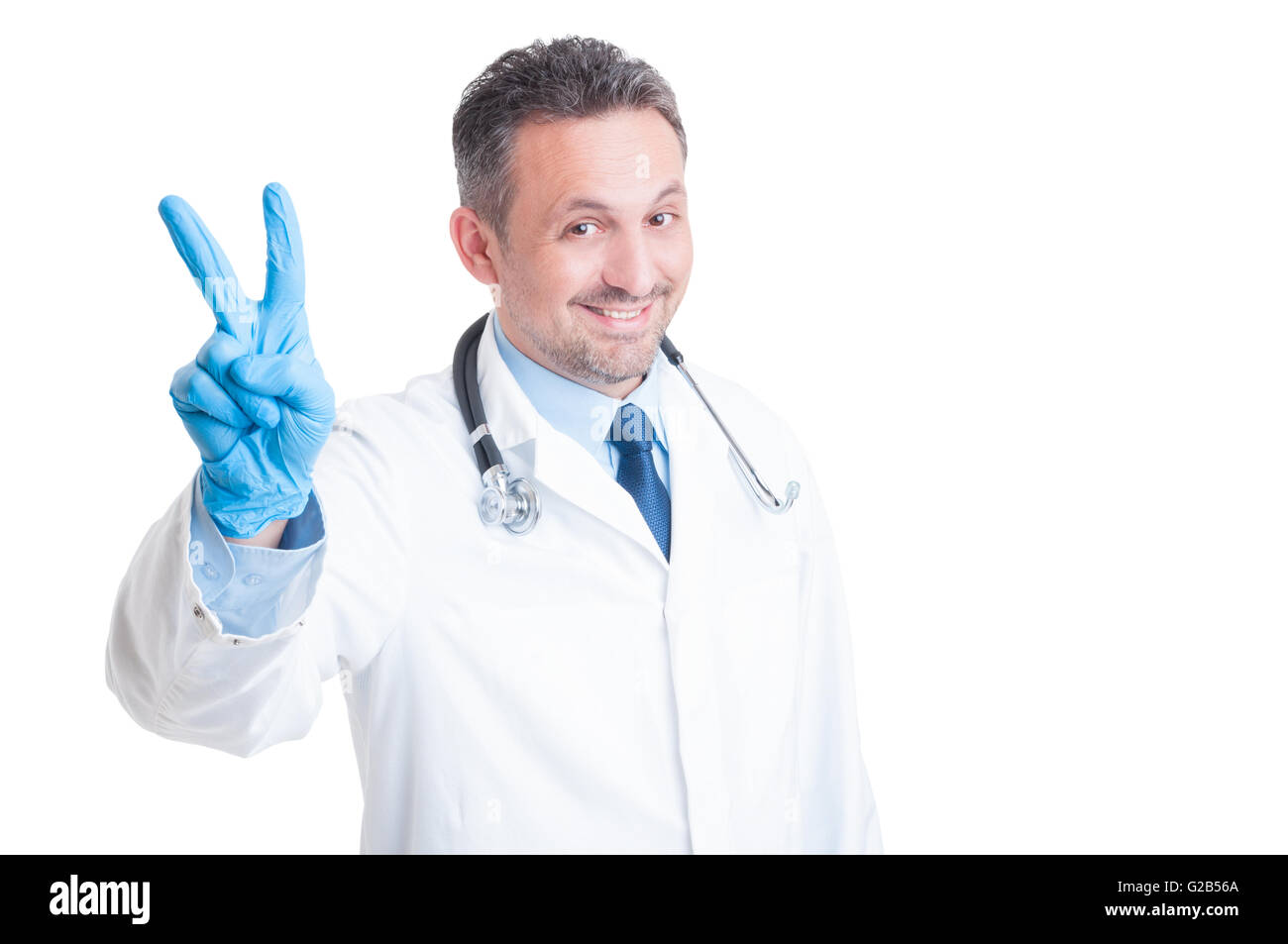Encouraging doctor or medic showing peace and victory gesture smiling ...
