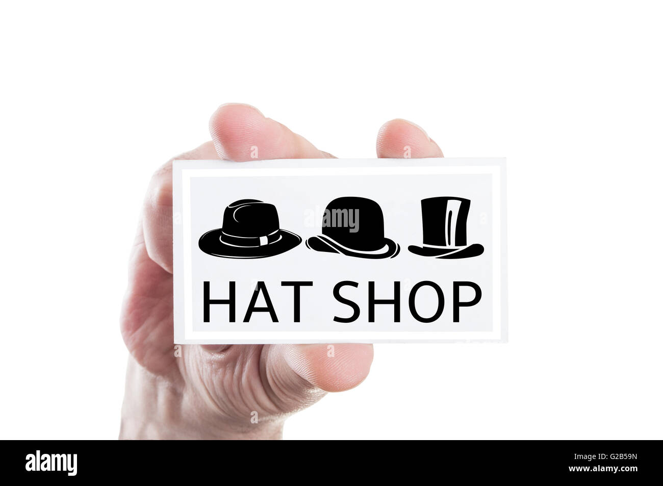 Hat shop concept with cap shape or silhouette on a card Stock Photo - Alamy
