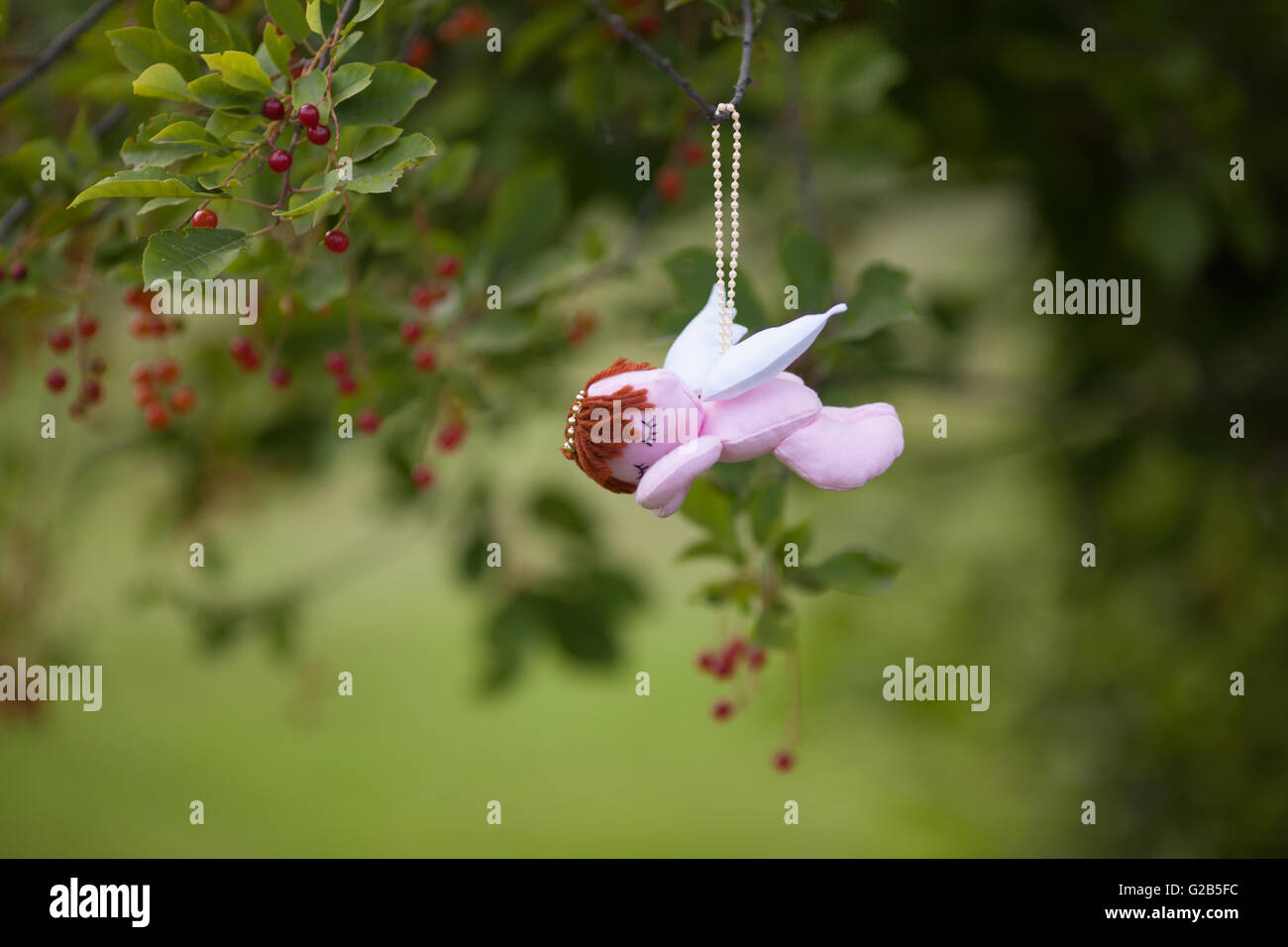 Angel and tree hi-res stock photography and images - Alamy