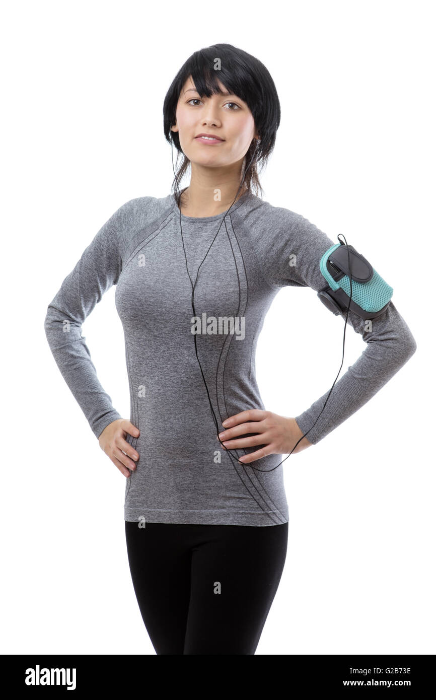 Upper body shot of a slim young female model with arms folded, wearing ...