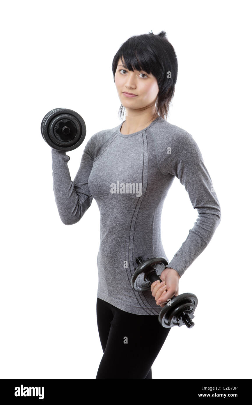 Upper body shot of a slim young female fitness model, wearing a long ...