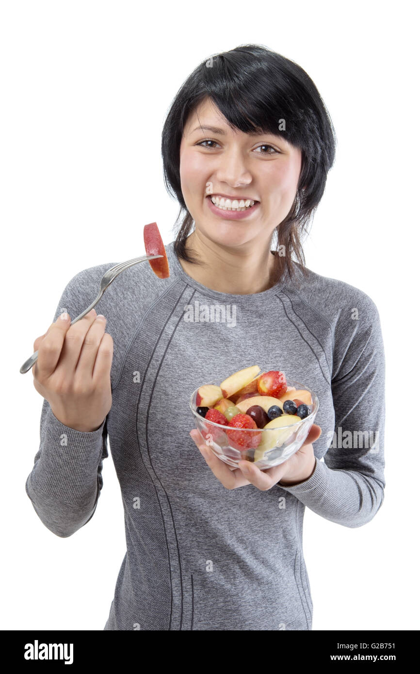 Pretty girl eating fruit salad hi-res stock photography and images - Alamy