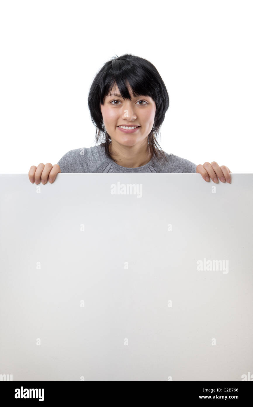 Close up shot of a billboard with a young woman looking over sign ...