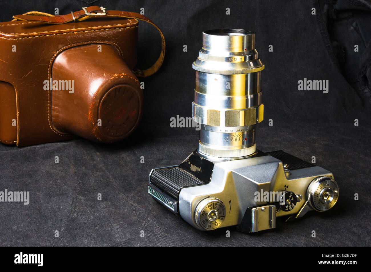 old vintage Soviet camera with leather case on black background Stock ...