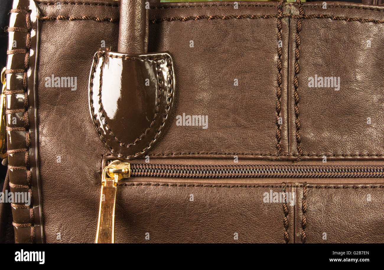 closeup of the fittings on the brown leather hand bag Stock Photo - Alamy