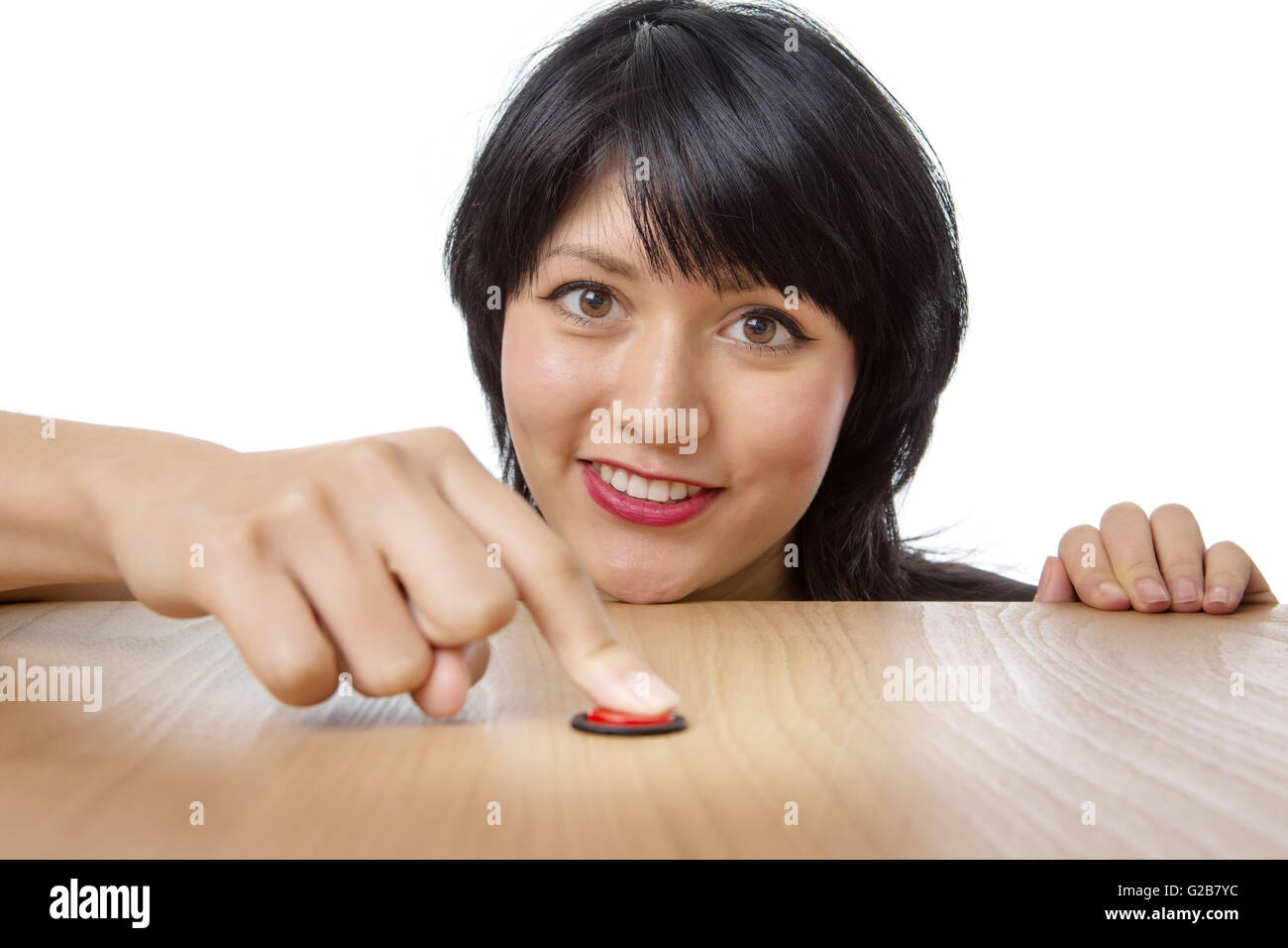 Studio shot of a thoughtful model holding her finger pushing a red ...