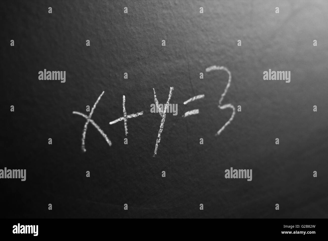 Maths formulas written by white chalk on the chalkboard background ...