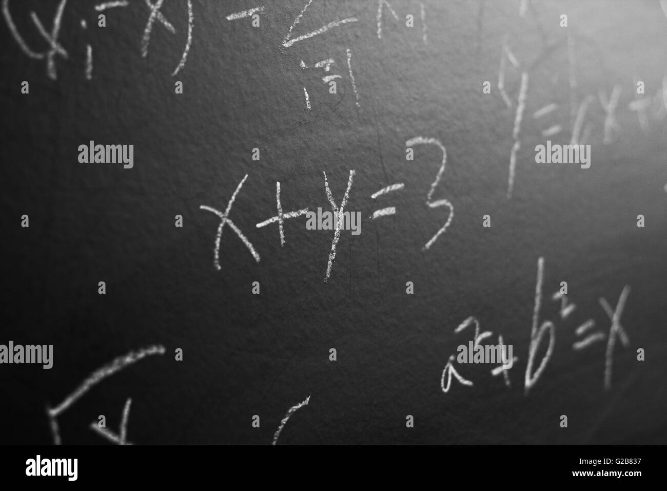 Maths formulas written by white chalk on the chalkboard background ...
