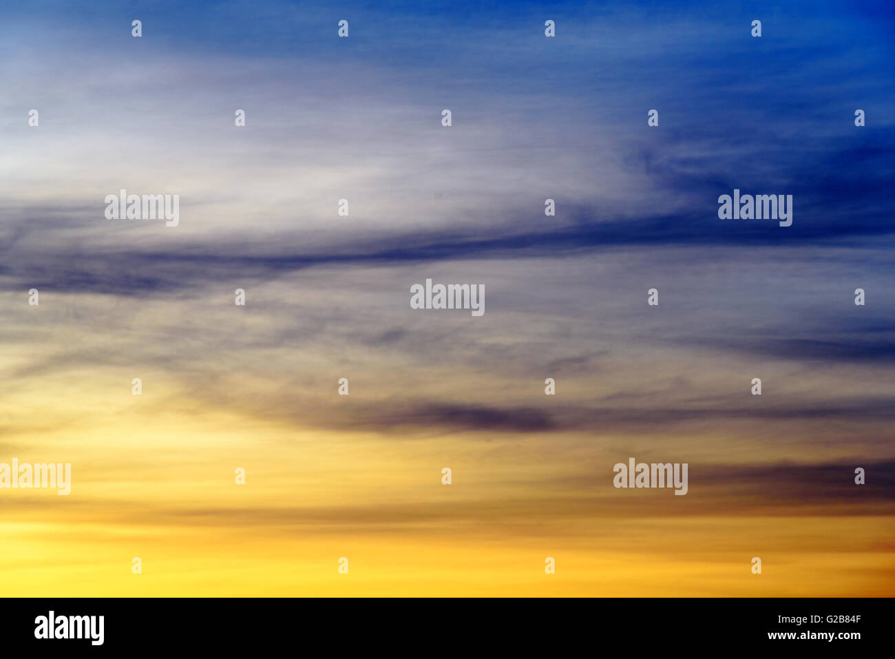 Blue and yellow sky at sunset. Background, texture Stock Photo - Alamy