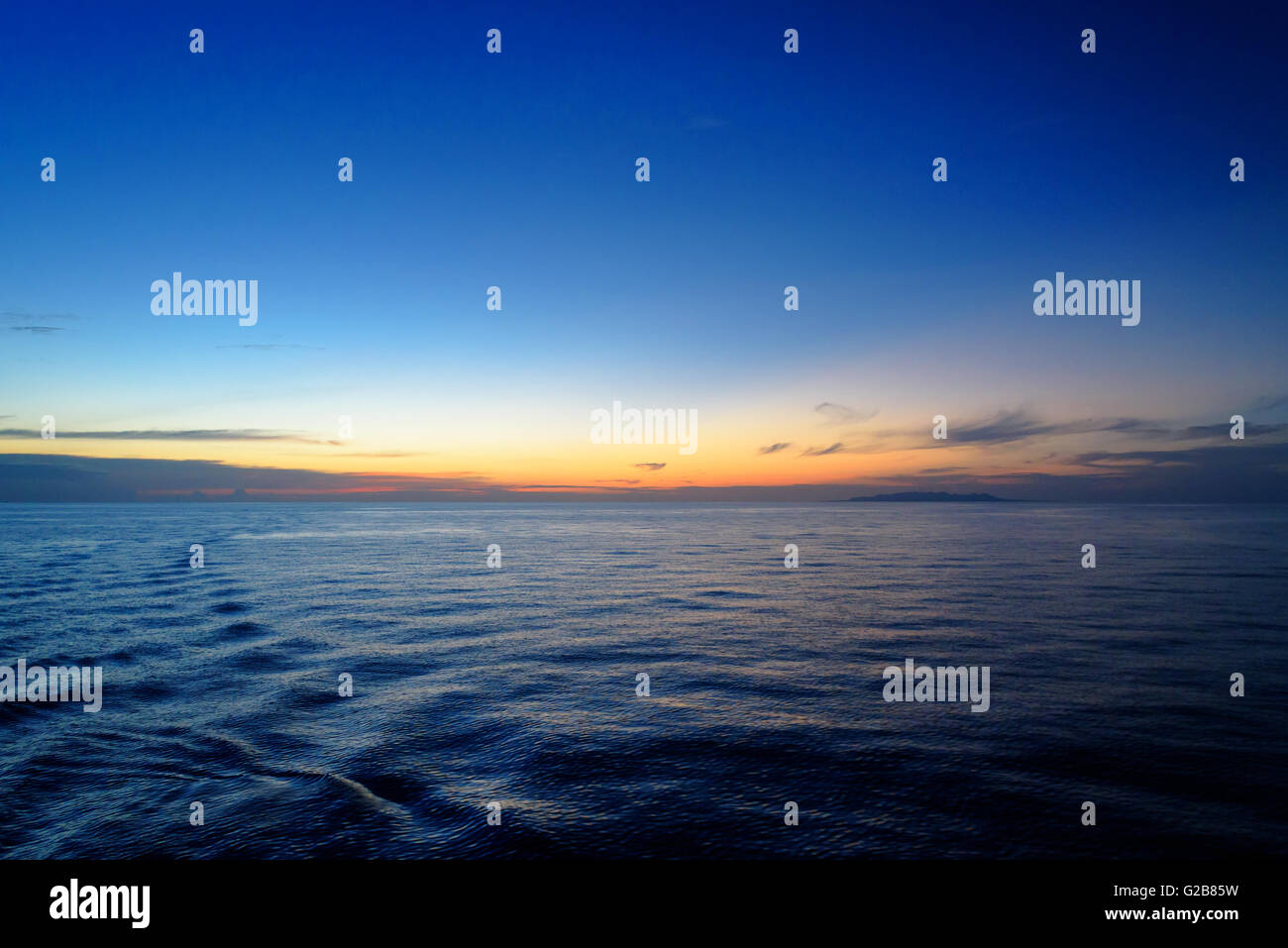 Beautiful sunset at the equator. View from ferry Stock Photo - Alamy