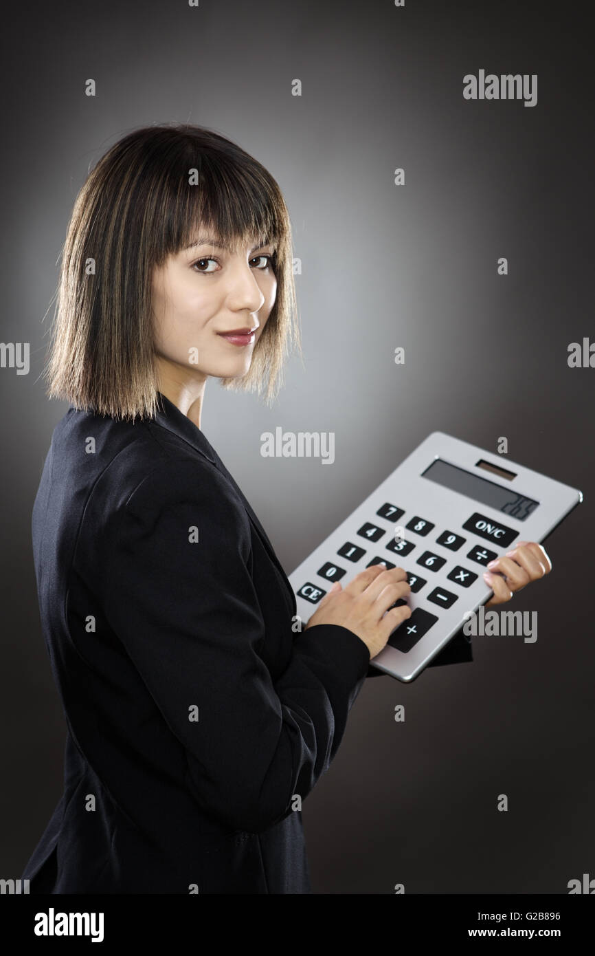 Asian woman female using calculator hi-res stock photography and images ...
