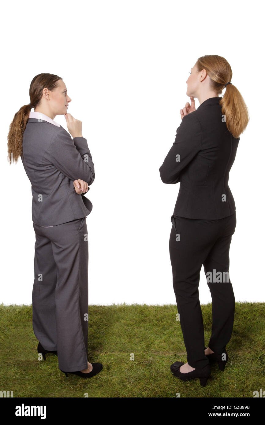 Full length studio shot taken from behind of two business models ...