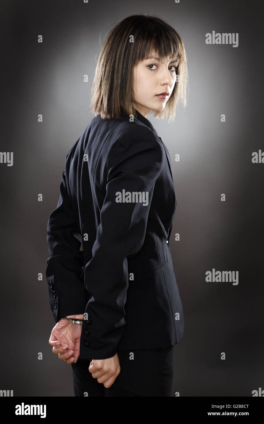 Woman in business suit handcuffed hi-res stock photography and images ...