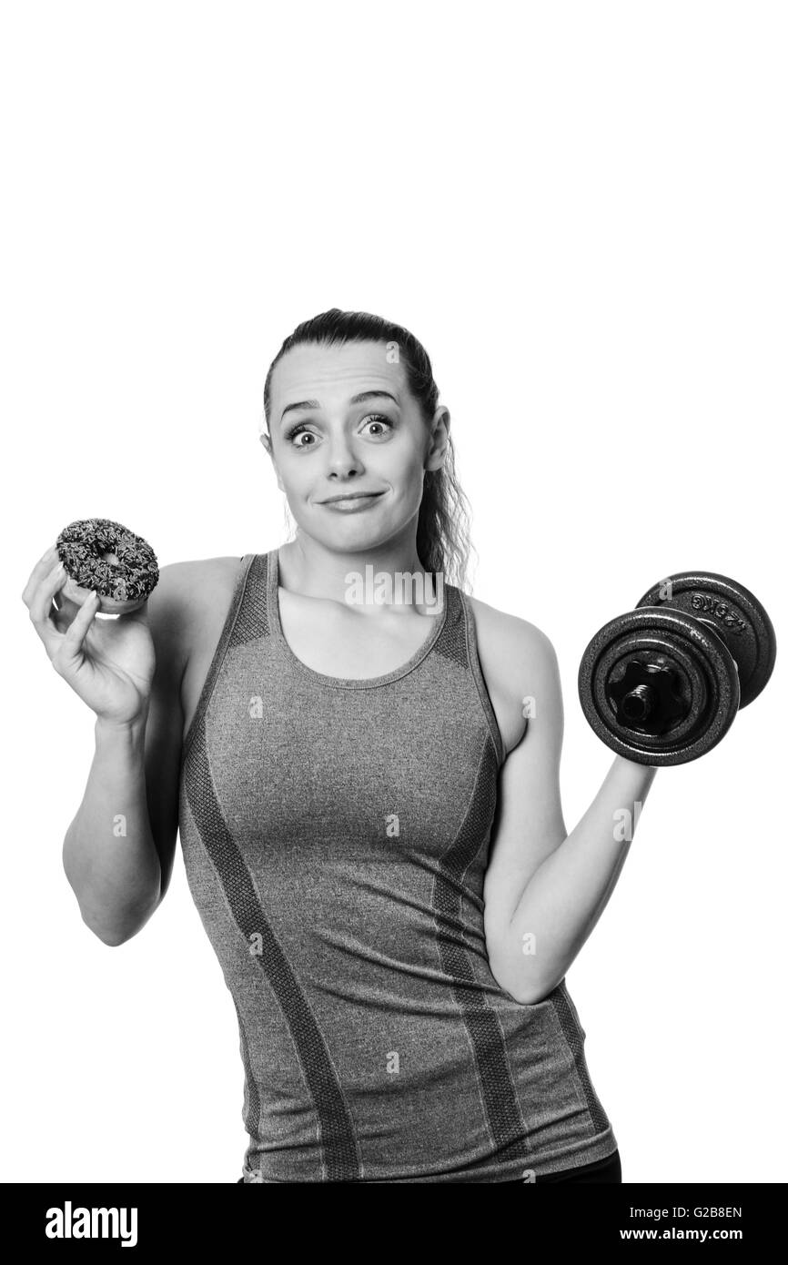 single woman trying to work out if she should be healthy Stock Photo ...
