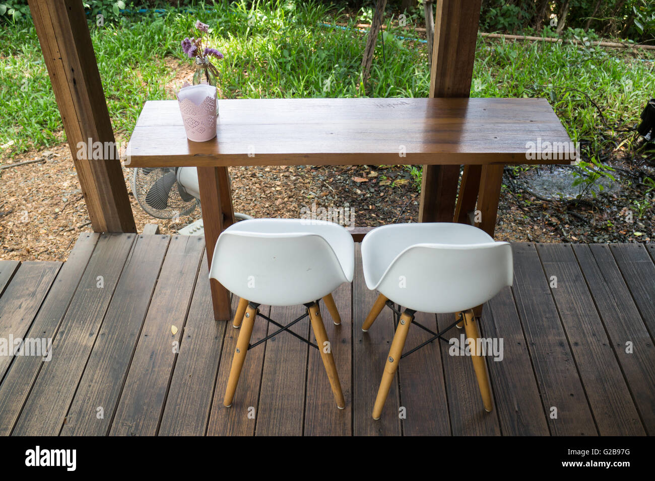 Wooden table and modern chair, stock photo Stock Photo - Alamy
