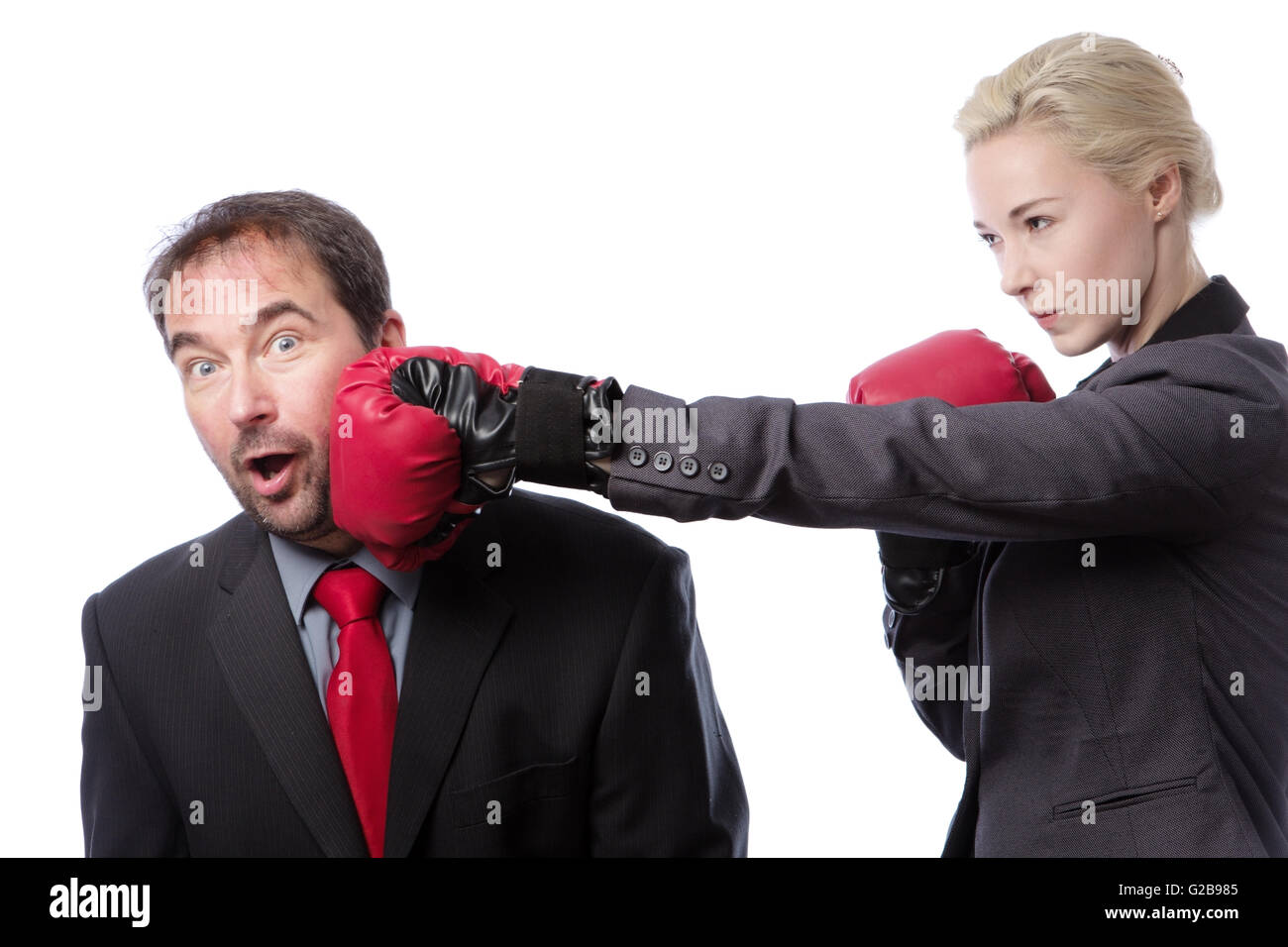 A businessman receiving punch to the side of his head from his co ...