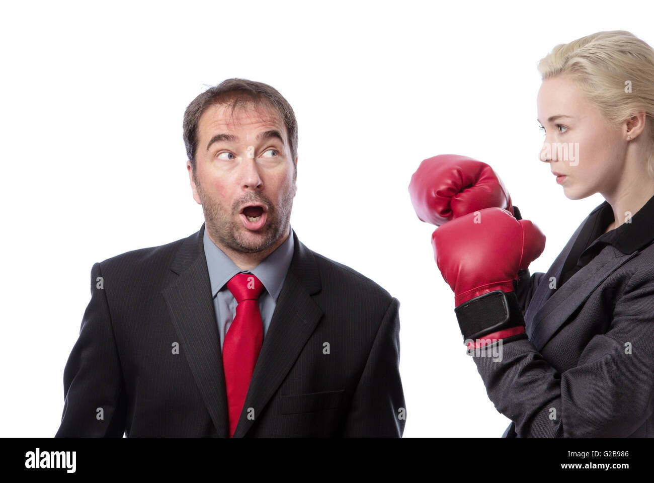 Upper body shot of two co-workers getting ready for a fight, one ...