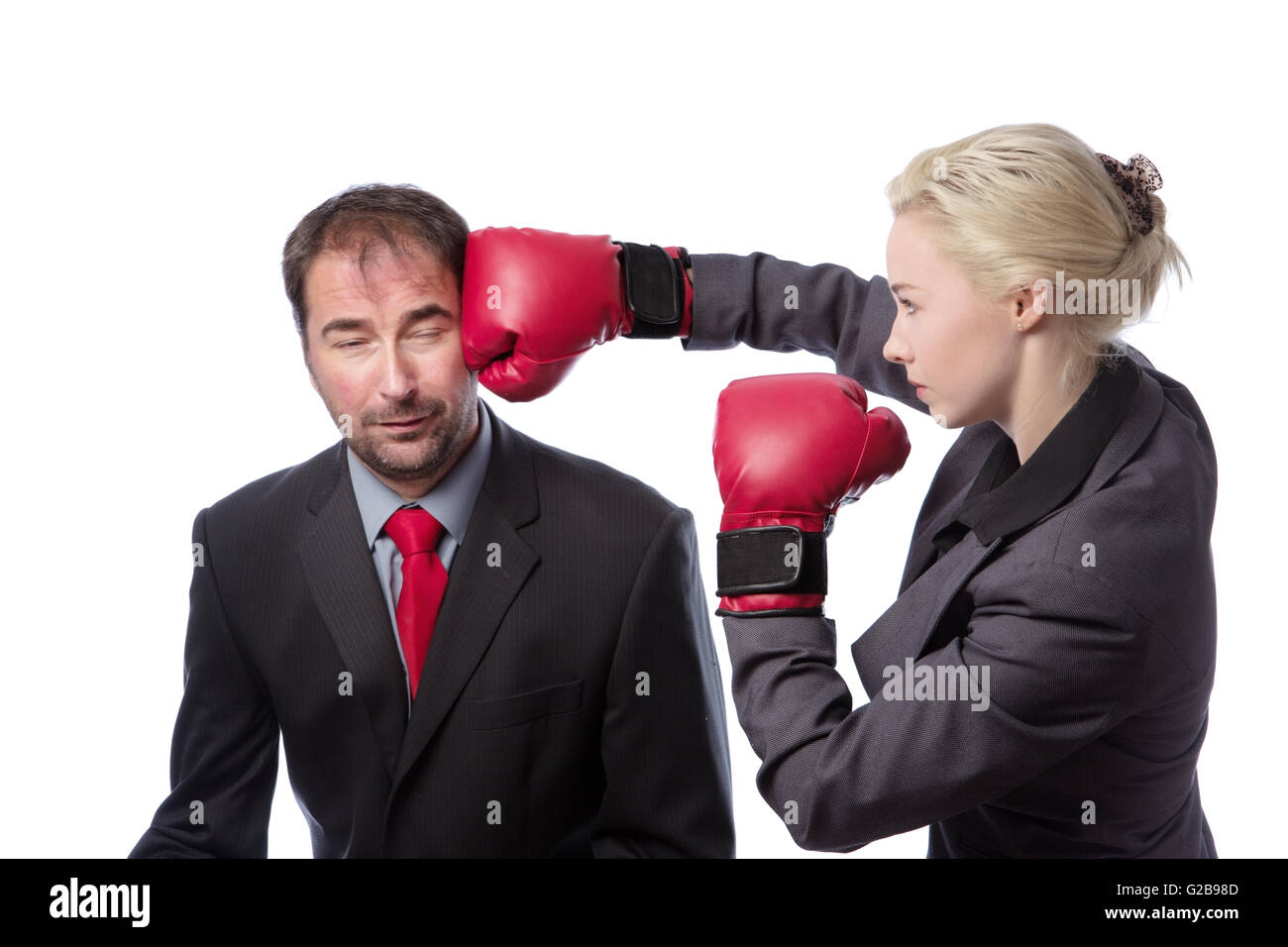 A businessman receiving punch to the side of his head from his co ...