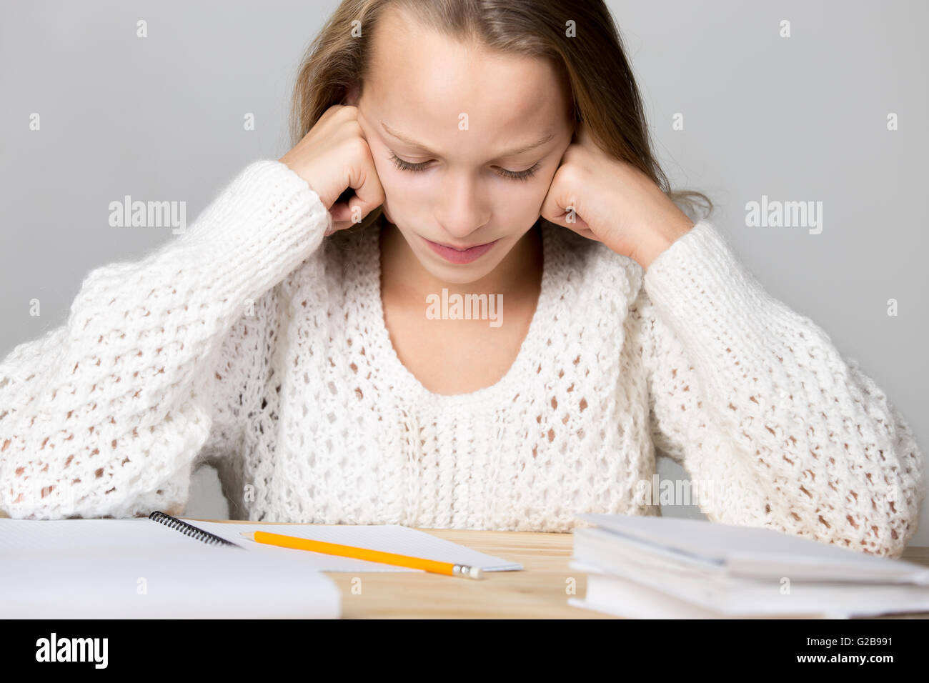 Stressed teen girl studying hi-res stock photography and images - Alamy