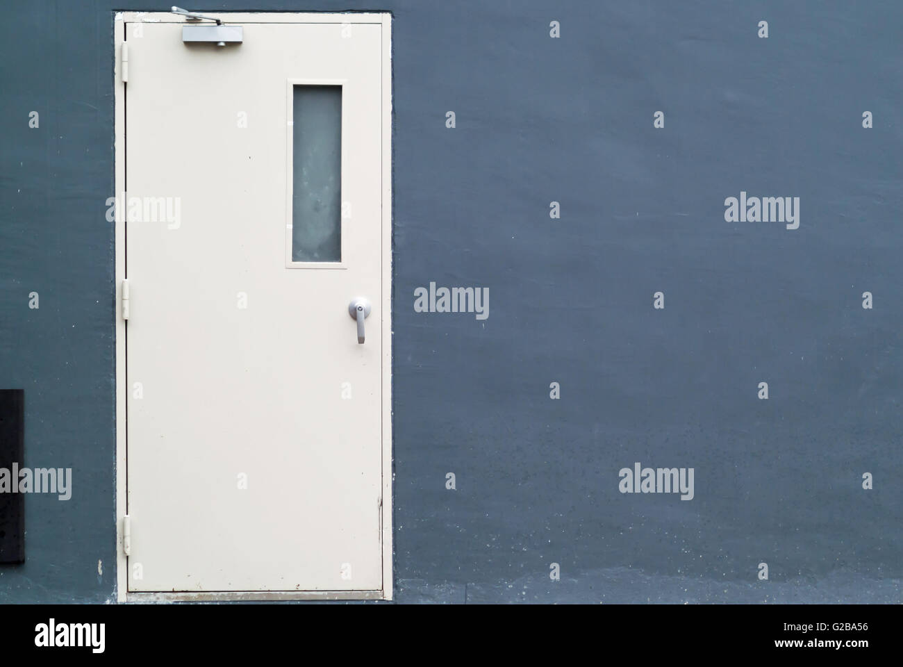 An White door with wet floor Stock Photo - Alamy