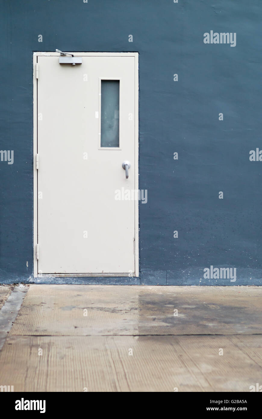 An White door with wet floor Stock Photo - Alamy