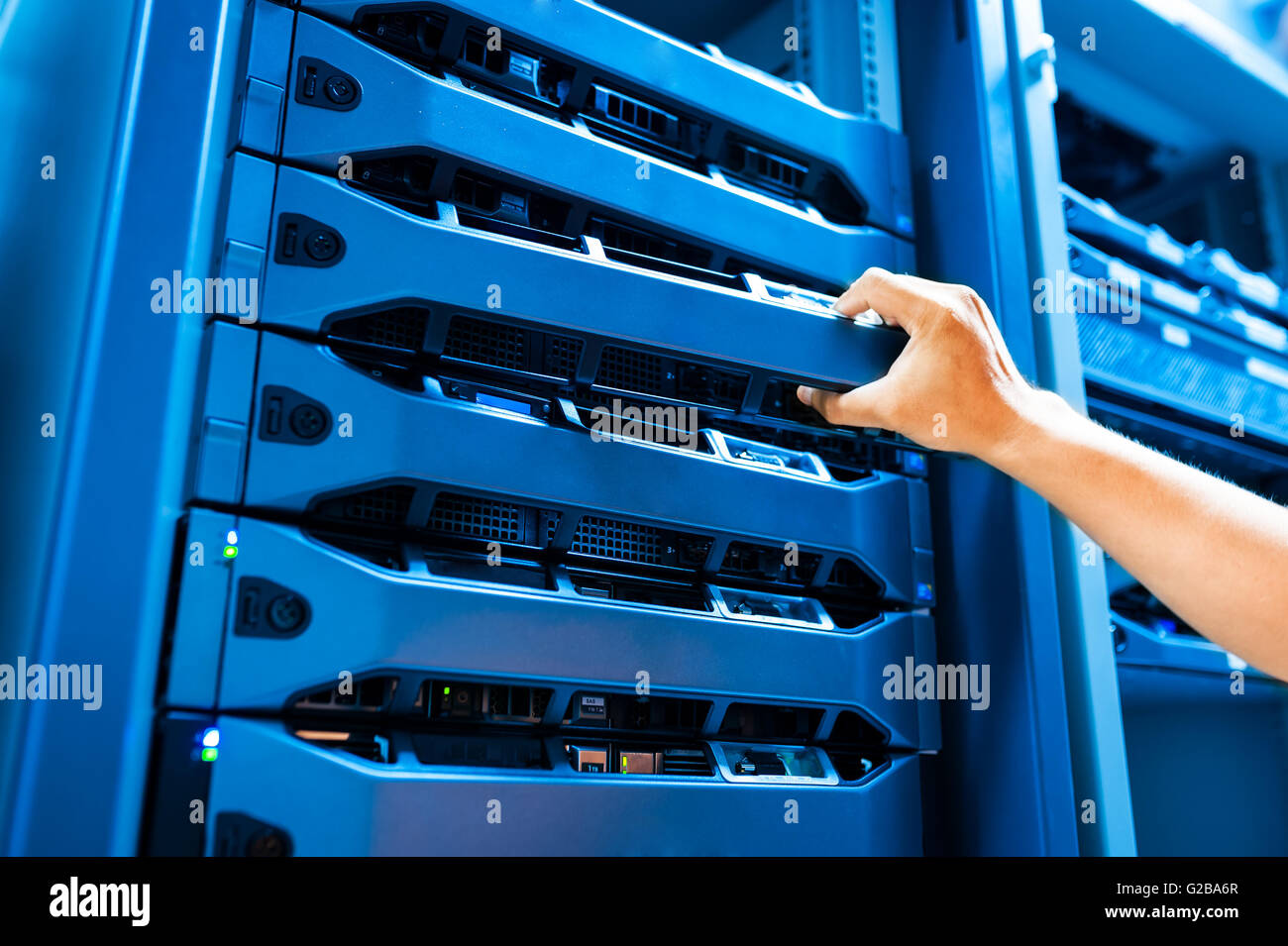 People fix server network in data room Stock Photo - Alamy