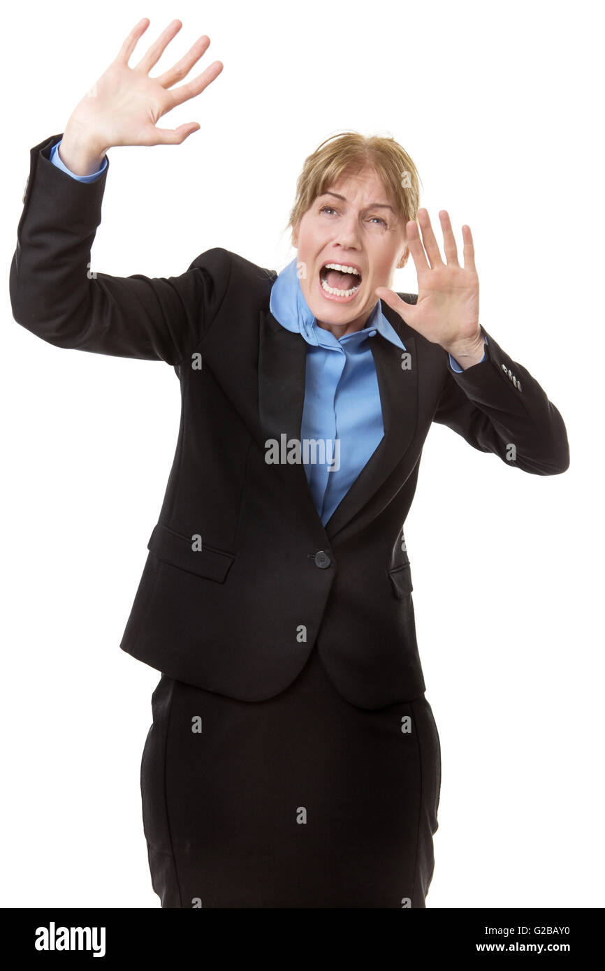 Studio shot of a Scared business woman defending herself with her arms ...