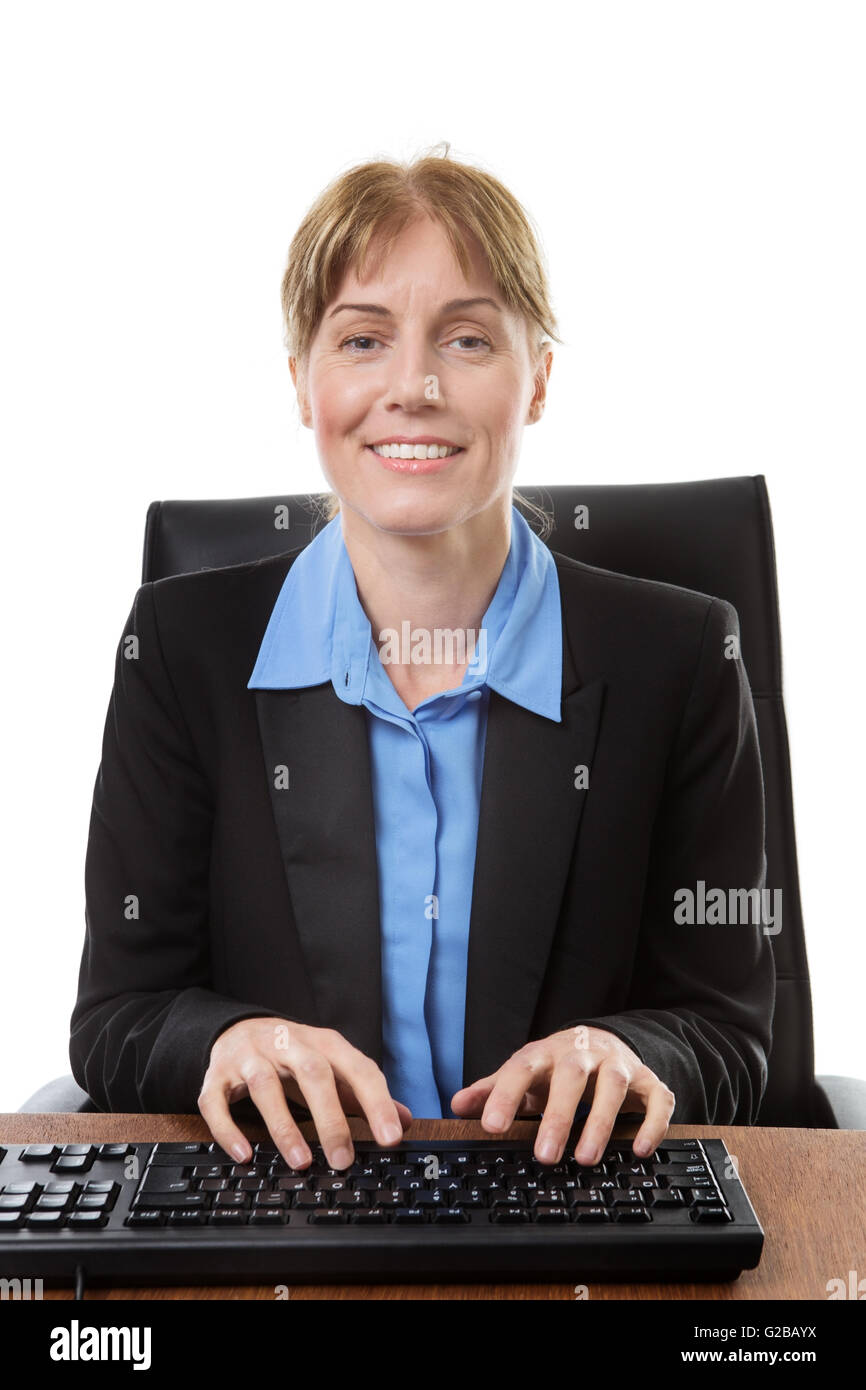 Office worker sits at her desk, ready to type on a keyboard, isoalted ...