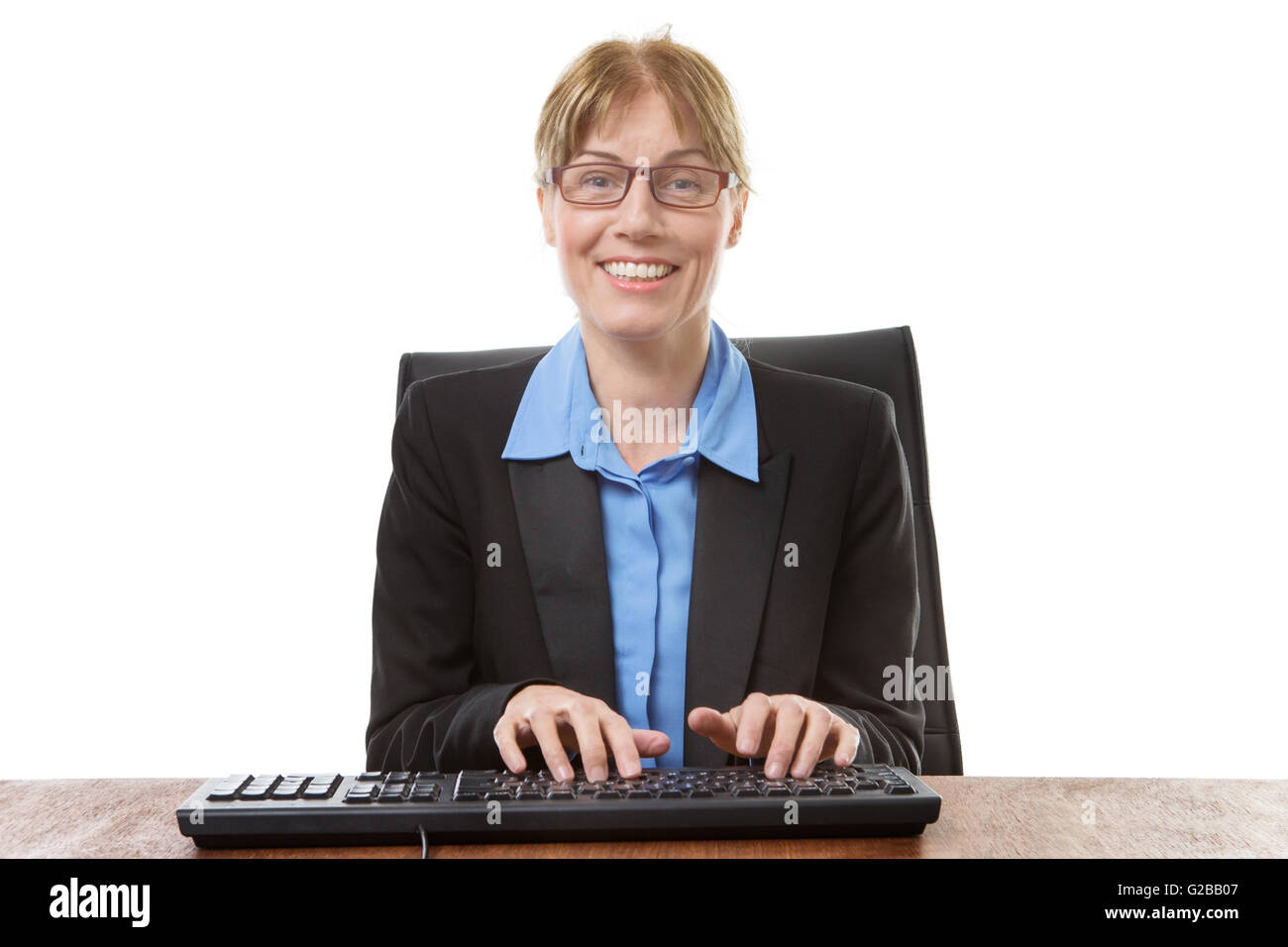 Office worker sits at her desk, ready to type on a keyboard, isoalted ...