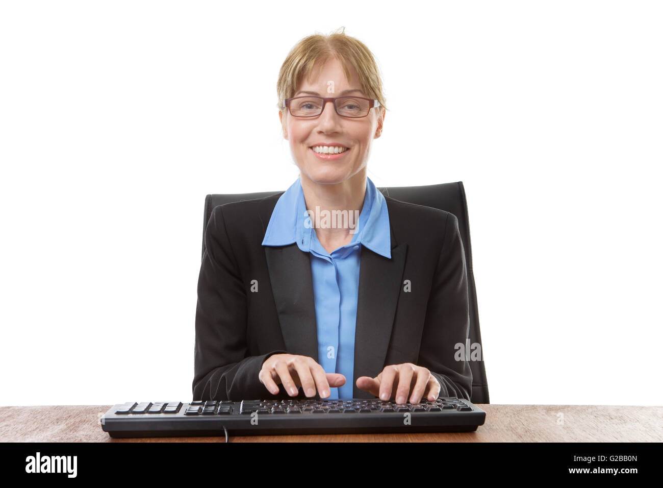 Office worker sits at her desk, ready to type on a keyboard, isoalted ...