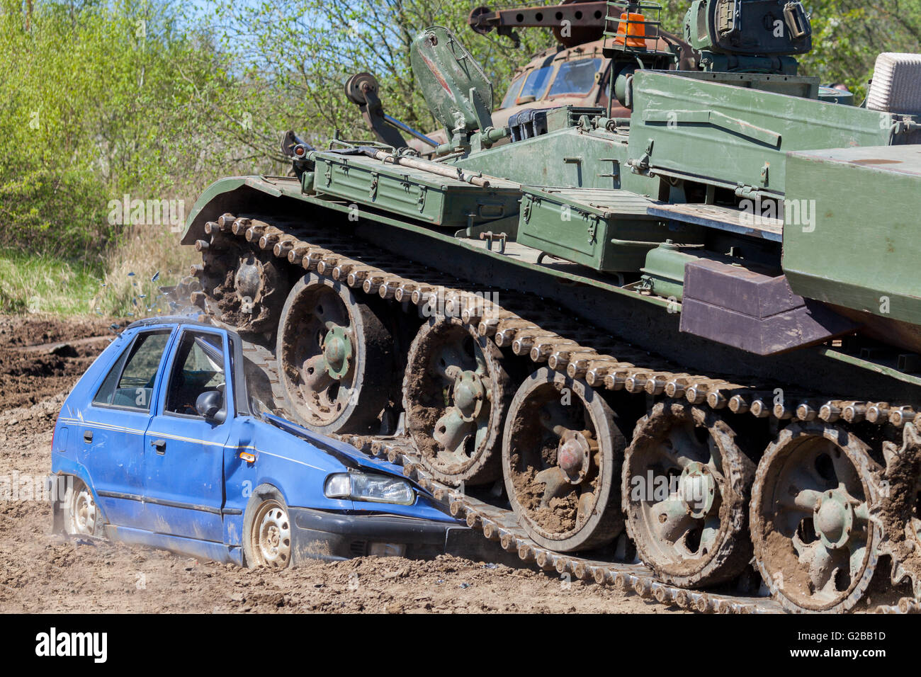military tank crushes a blue car Stock Photo - Alamy